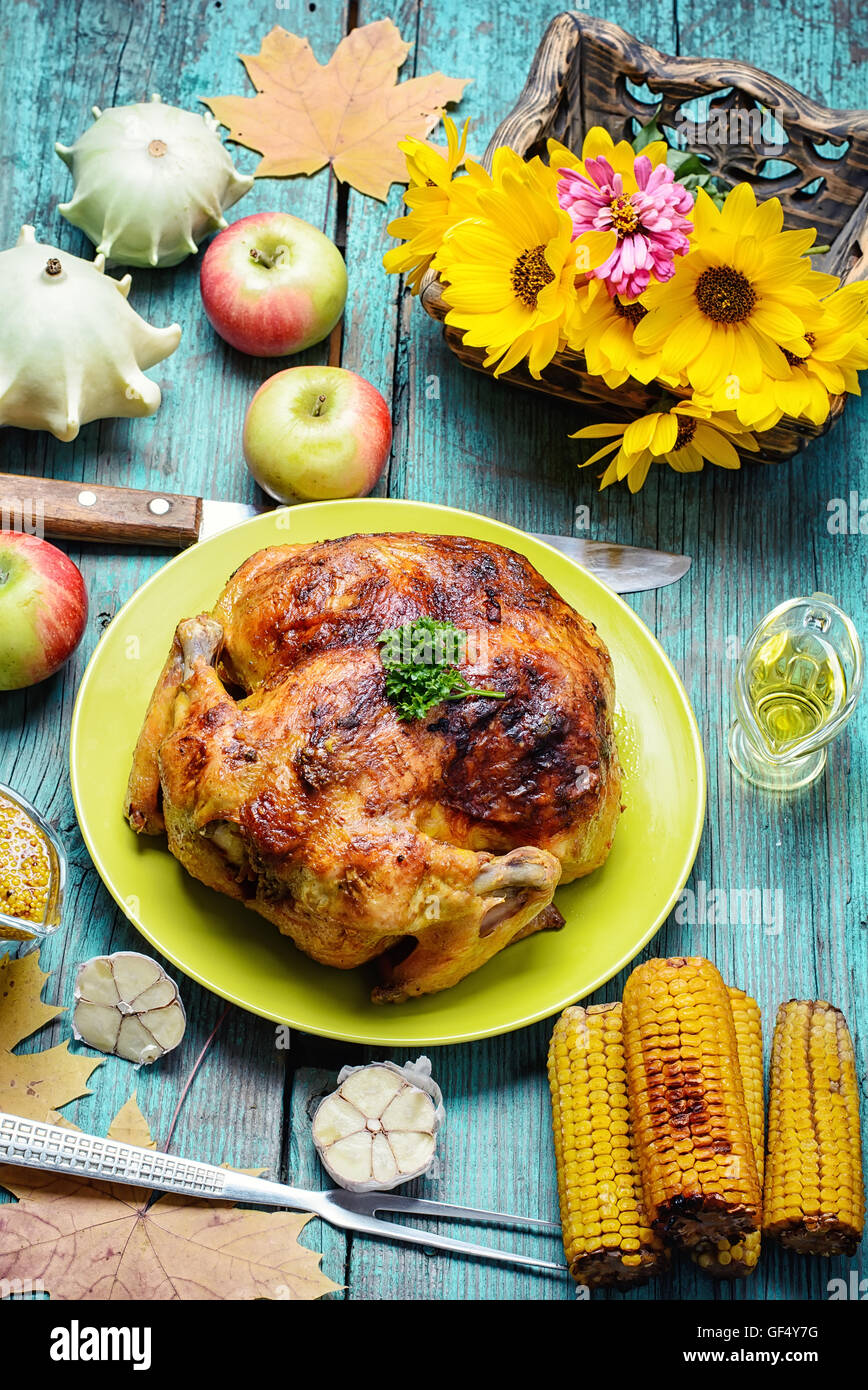 Carcass of baked chicken with side dish with grilled vegetables Stock ...