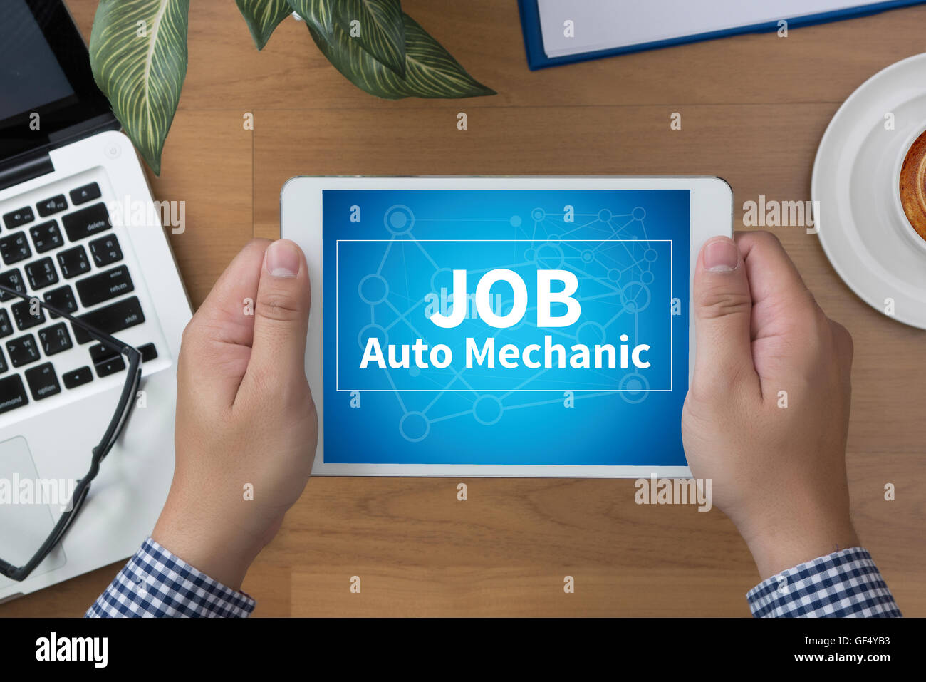 JOB Auto Mechanic man hand Tablet and coffee cup Stock Photo - Alamy