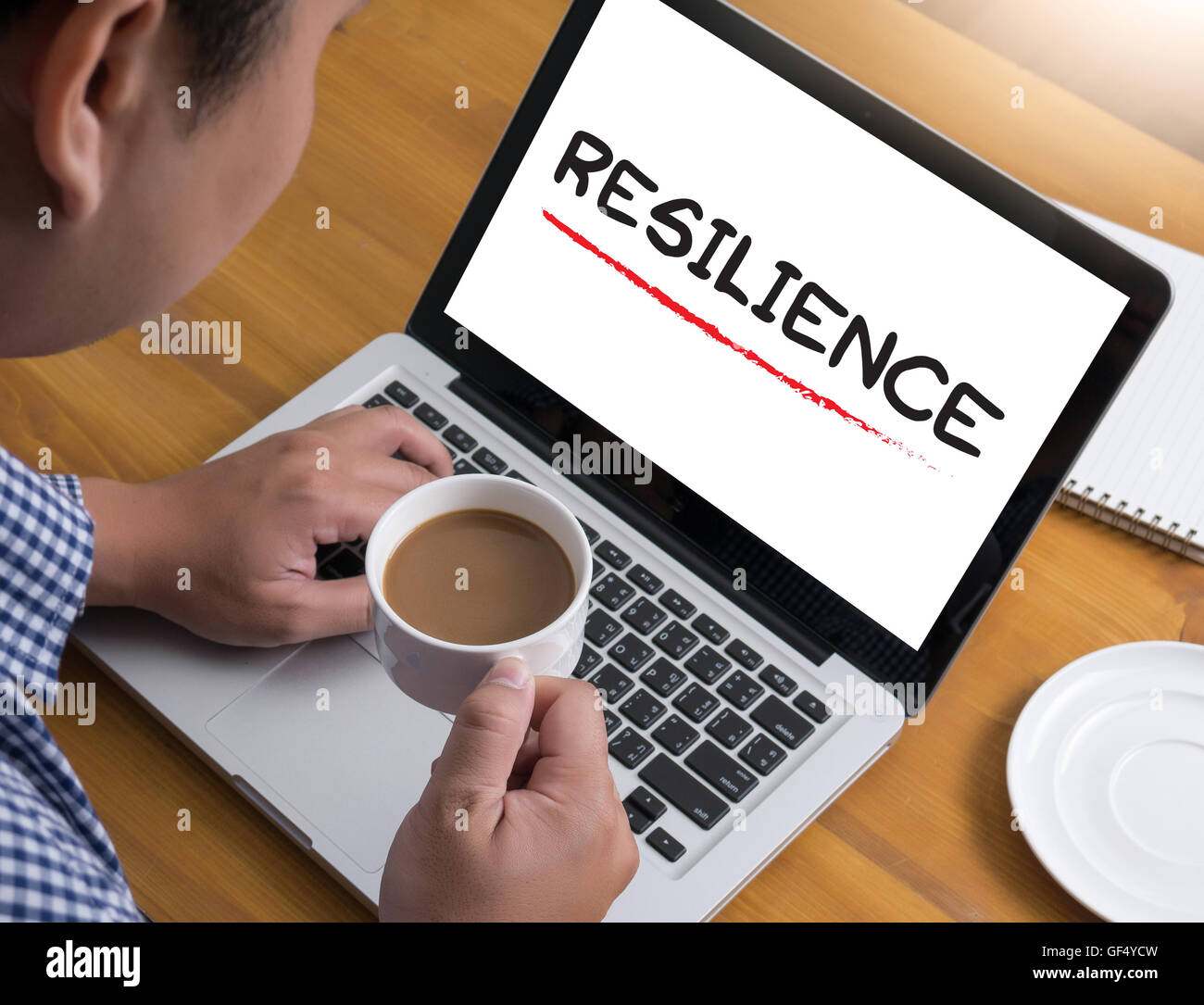 RESILIENCE Businessman at work. Close-up top view of man working on ...