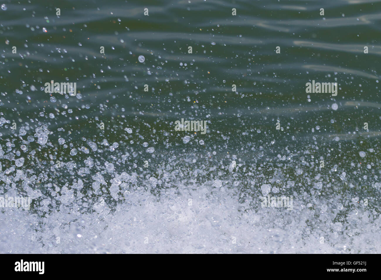 Drops of water from a wake speed boat Stock Photo - Alamy