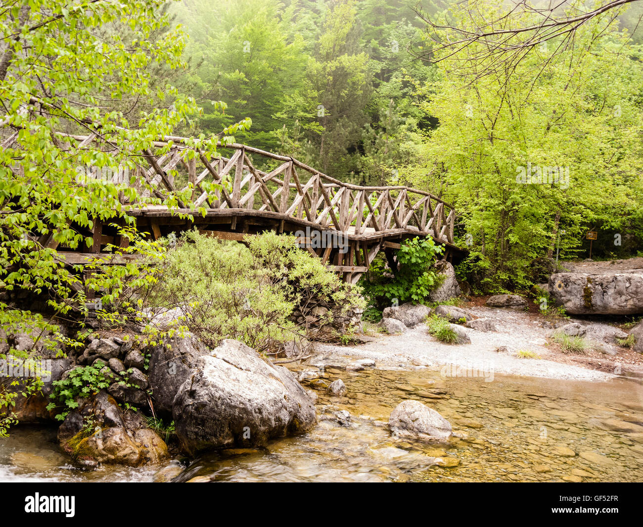 Wooden bridge over a river in the mountains of Olympus at Greece Stock ...