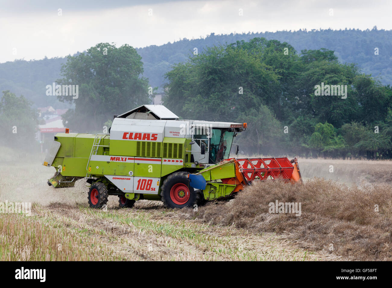 Harvester works in field hi-res stock photography and images - Alamy