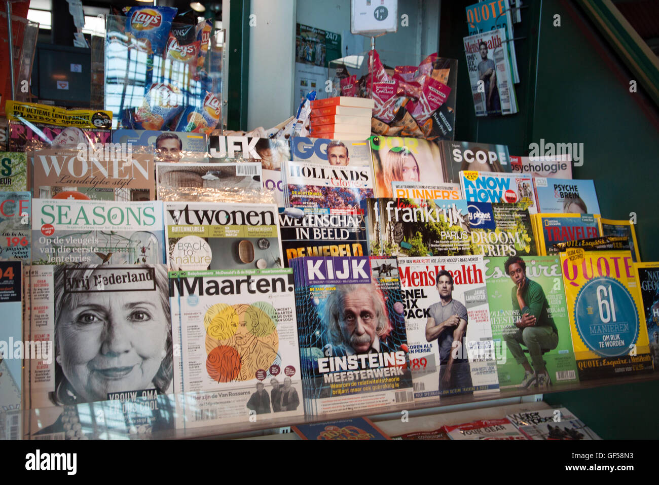 Person reading stack of magazines hi-res stock photography and images ...