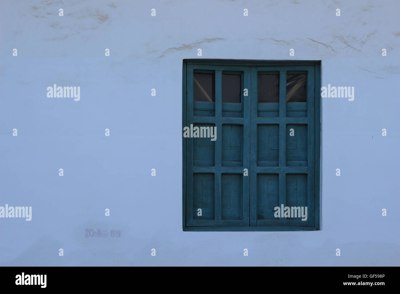 A window in the wall of a building in Cotacachi, Ecuador Stock Photo ...