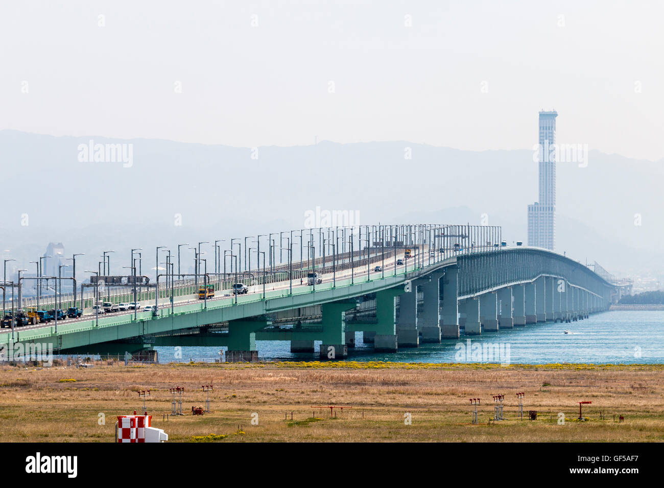 Japan, Kansai airport, KIX. Distant shot from airport of the road and ...