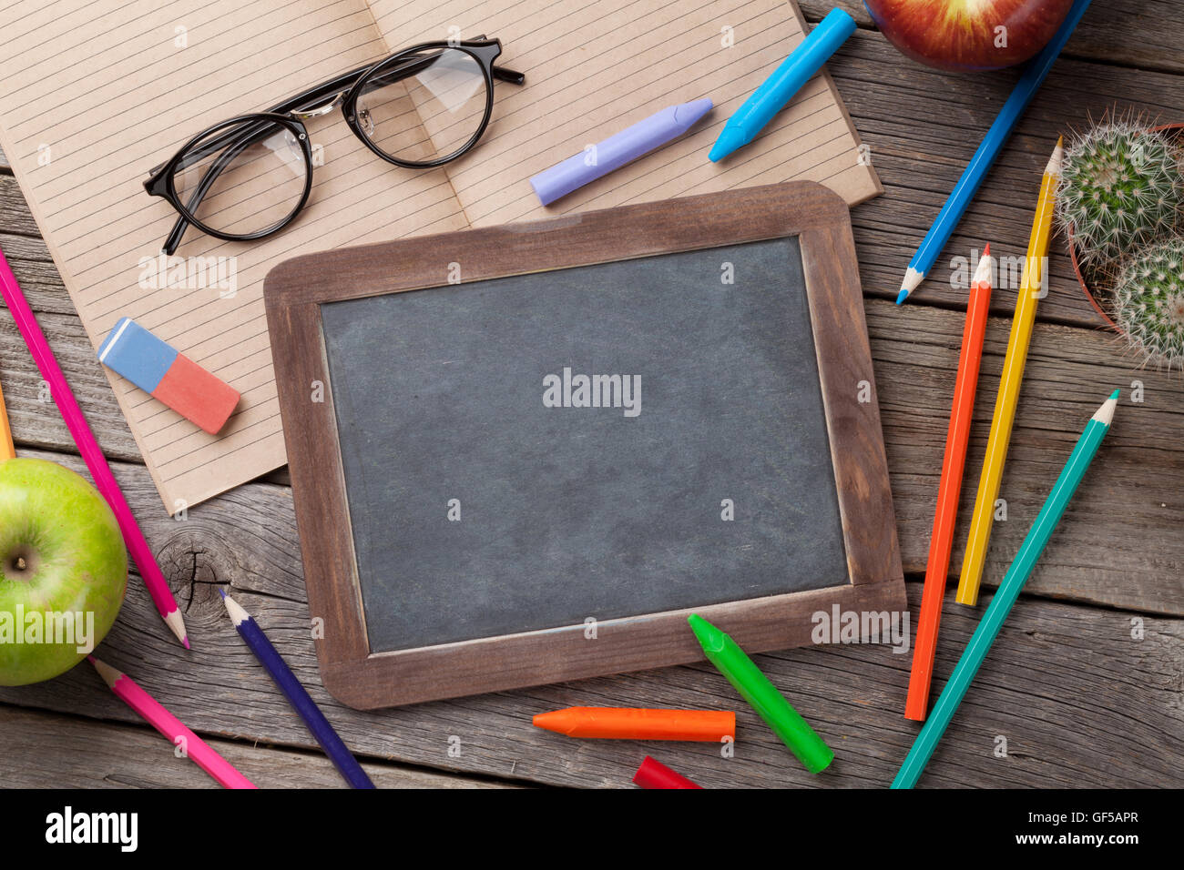 Chalk board for your text and colorful supplies. Back to school concept ...