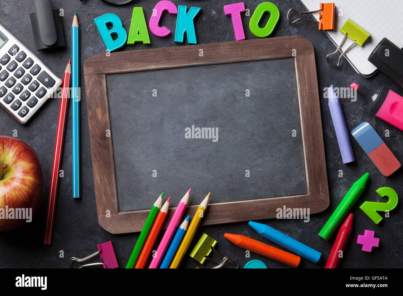 Supplies, apple and chalk board for your text. Back to school concept ...