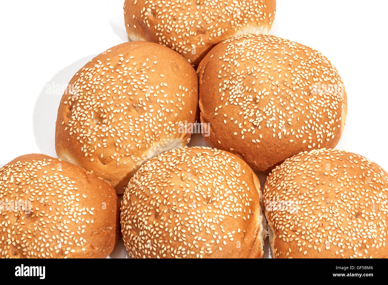 Close up of freshly baked golden sesame seed covered bread rolls Stock ...