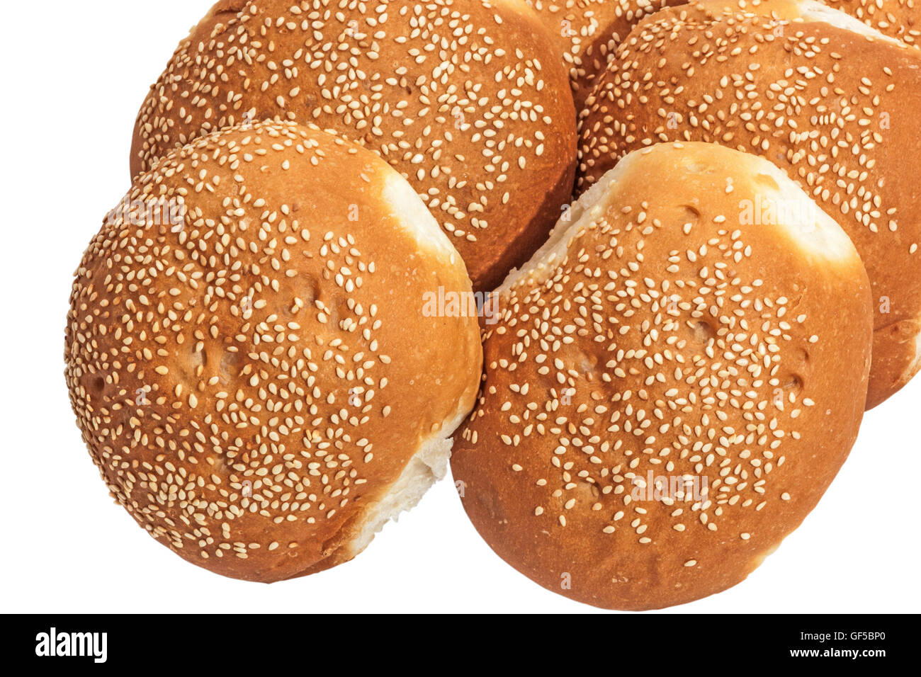 Close up of stacked freshly baked golden crisp sesame seed covered ...