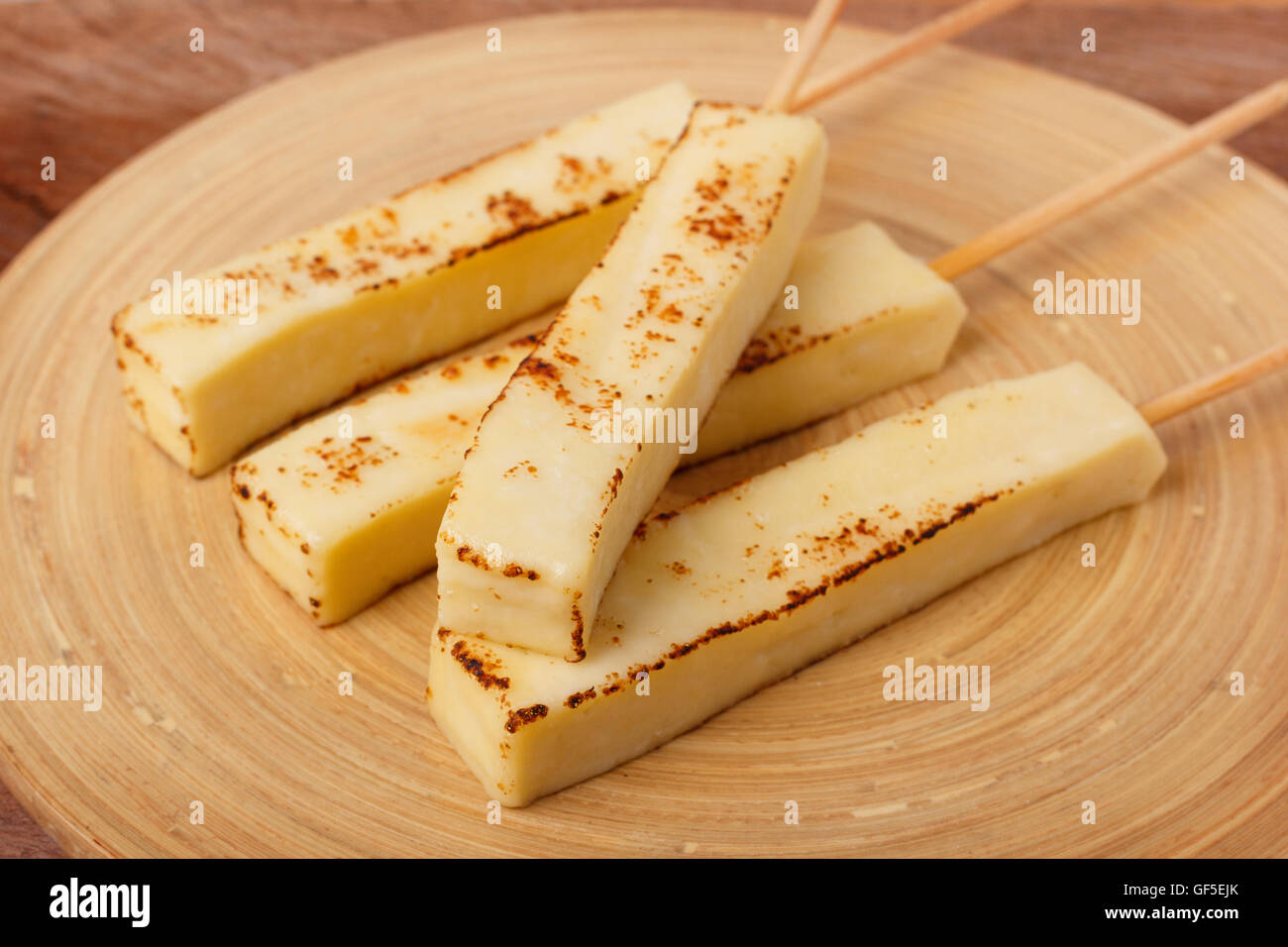 Brazilian traditional cheese queijo coalho on wooden board. Selective ...