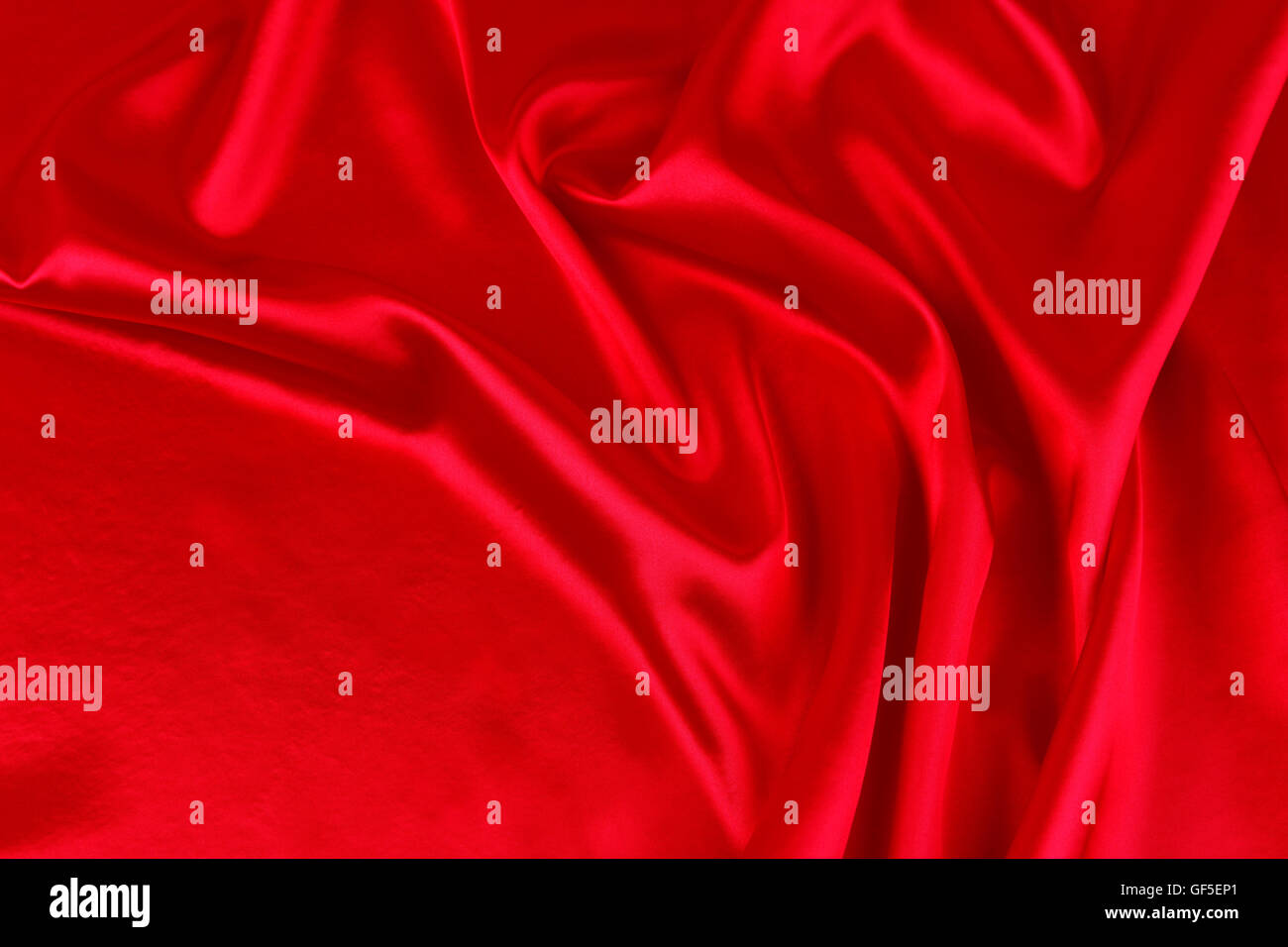 Closeup of ripples in red silk fabric Stock Photo - Alamy
