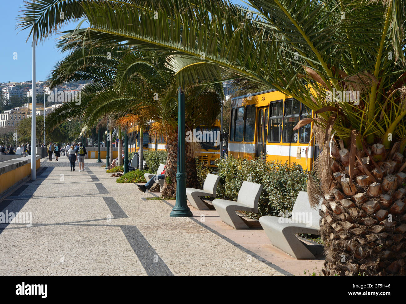 People strolling along the seafront promenade at Funchal in Madeira ...