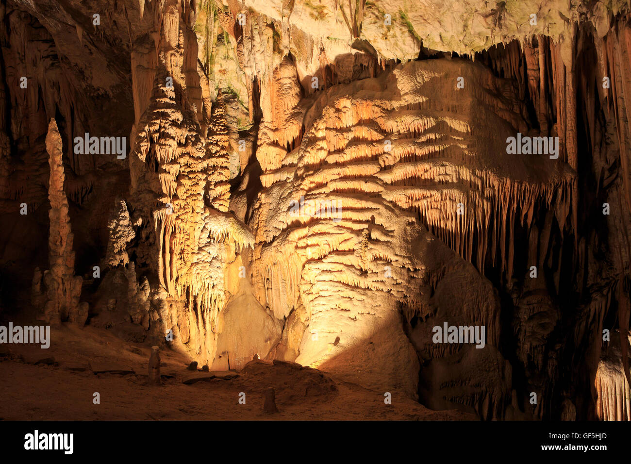 Limestone stalagmites, flow stones and a drapery at the Postojna Cave ...