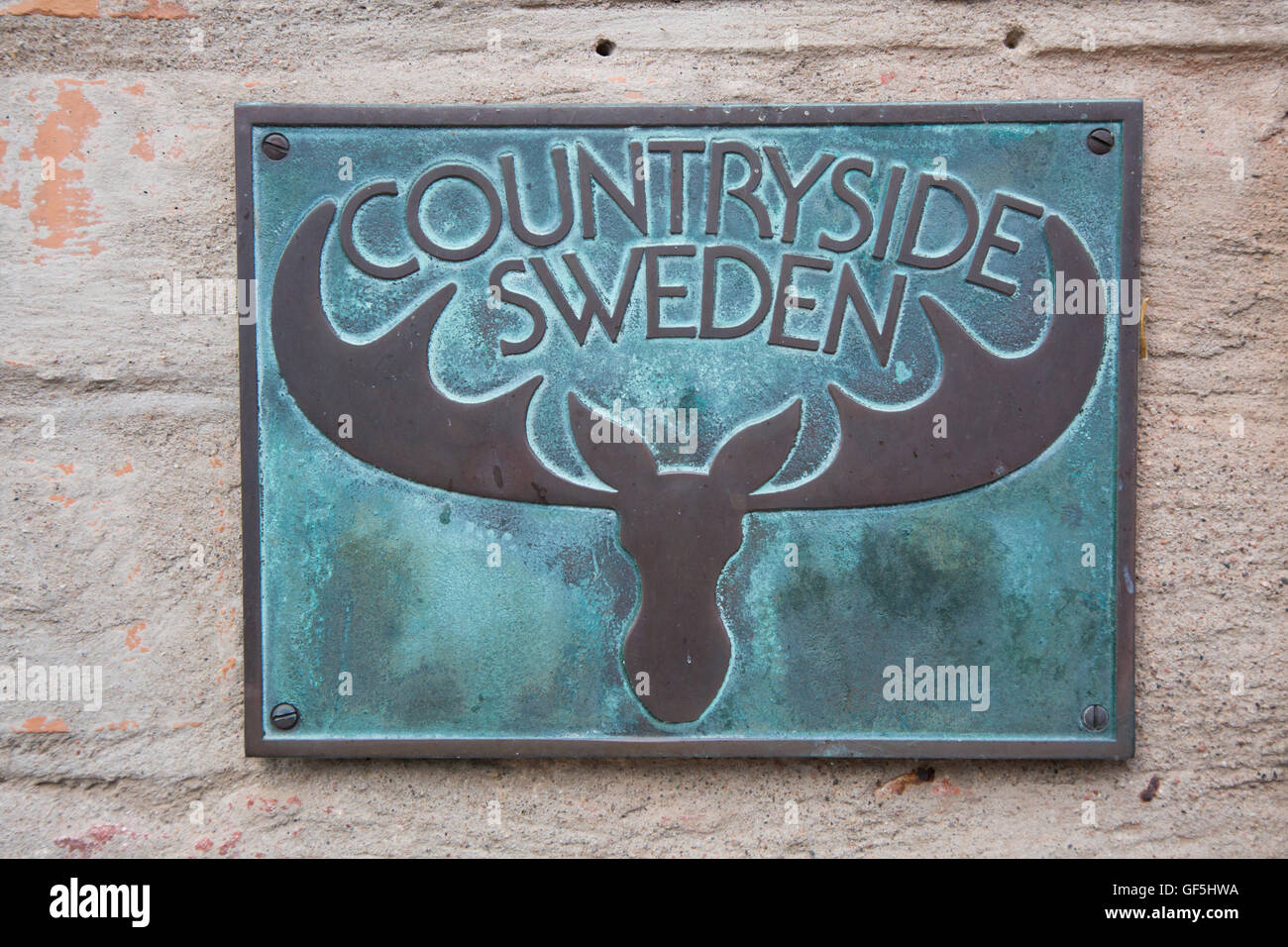 Vadstena Sweden 26 July 2016. Wall sign with moose head and horns, and ...
