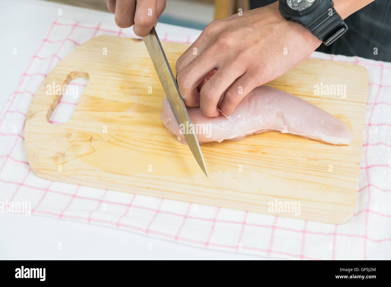 Man cutting meat hi-res stock photography and images - Alamy