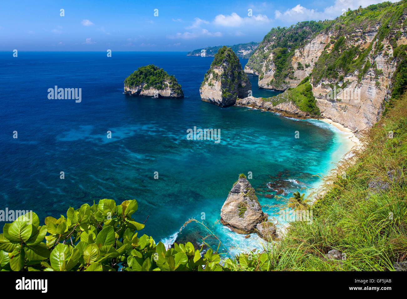 Azure beach with rocky mountains and clear water of Indian ocean at ...