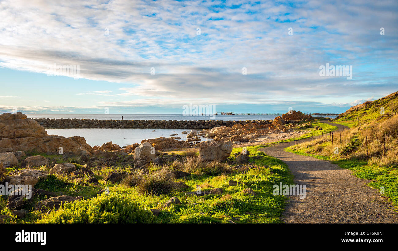 Footpath along the South Australian coast with fisherman silhouette on ...