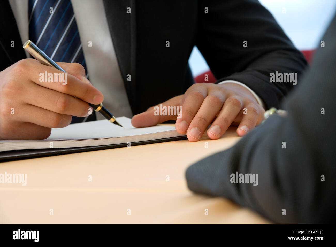 A man giving notes to a woman Stock Photo - Alamy