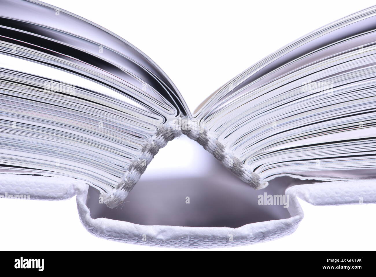 Open book close up isolated on white background Stock Photo - Alamy