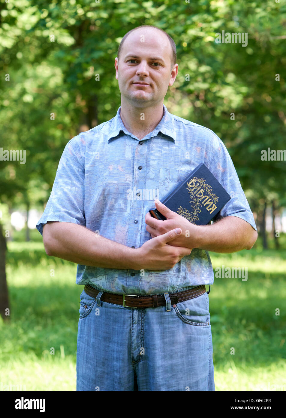 man with a Bible in his hand Stock Photo - Alamy