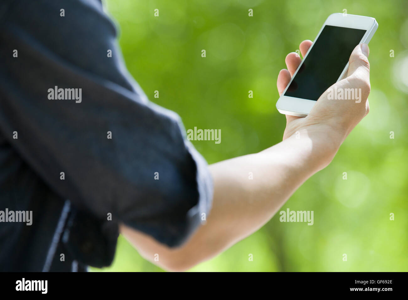 Young Chinese man using smart phone Stock Photo - Alamy