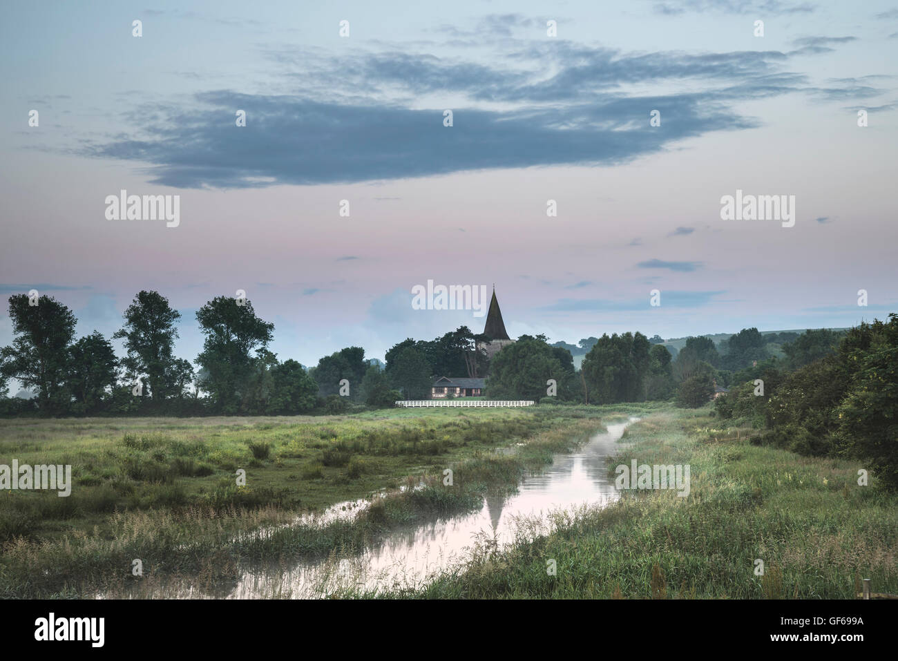 Stunning vibrant Summer sunrise over English countryside landscape ...