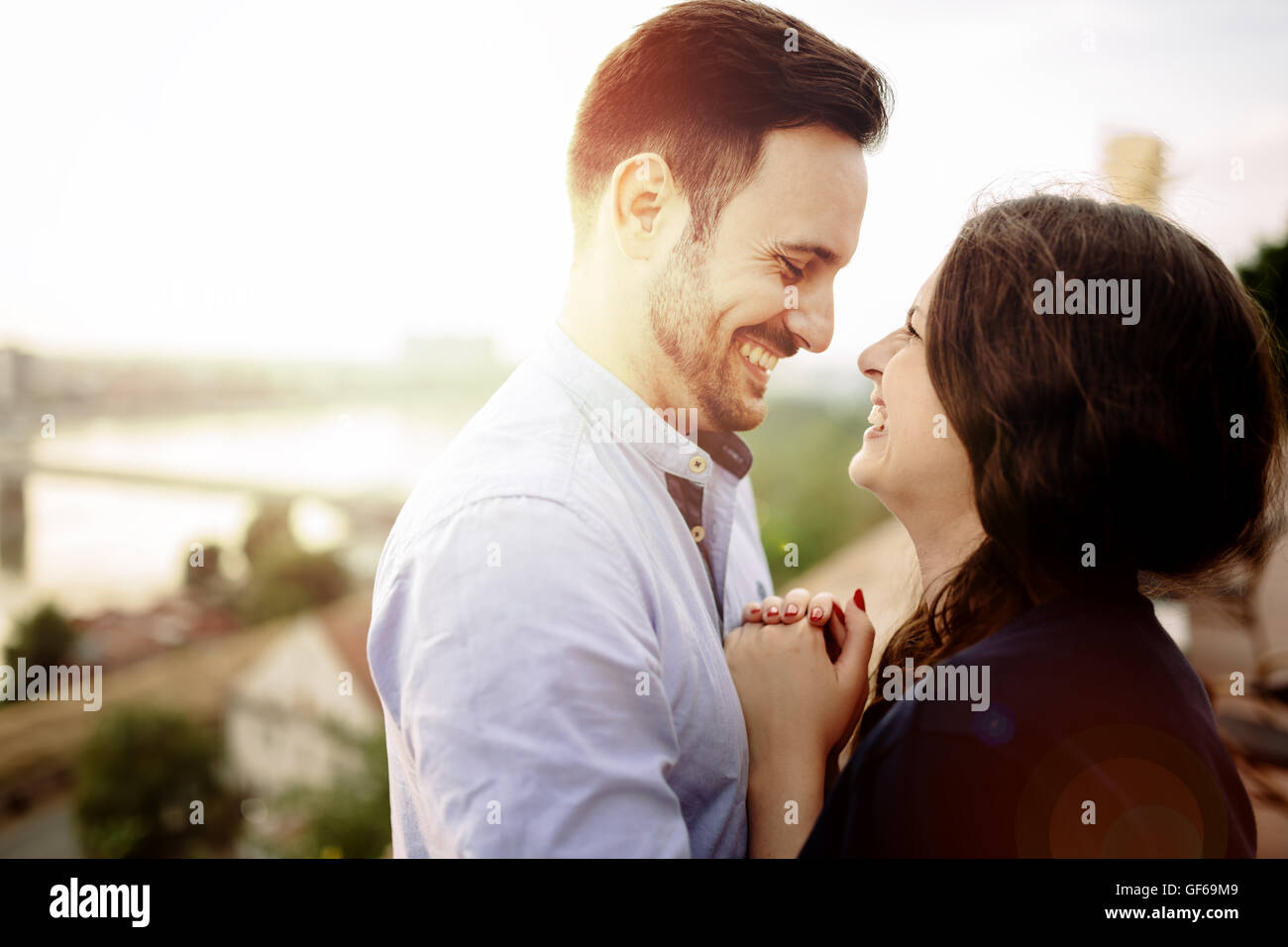 Couple in love hugging outdoors and sharing true emotions Stock Photo ...