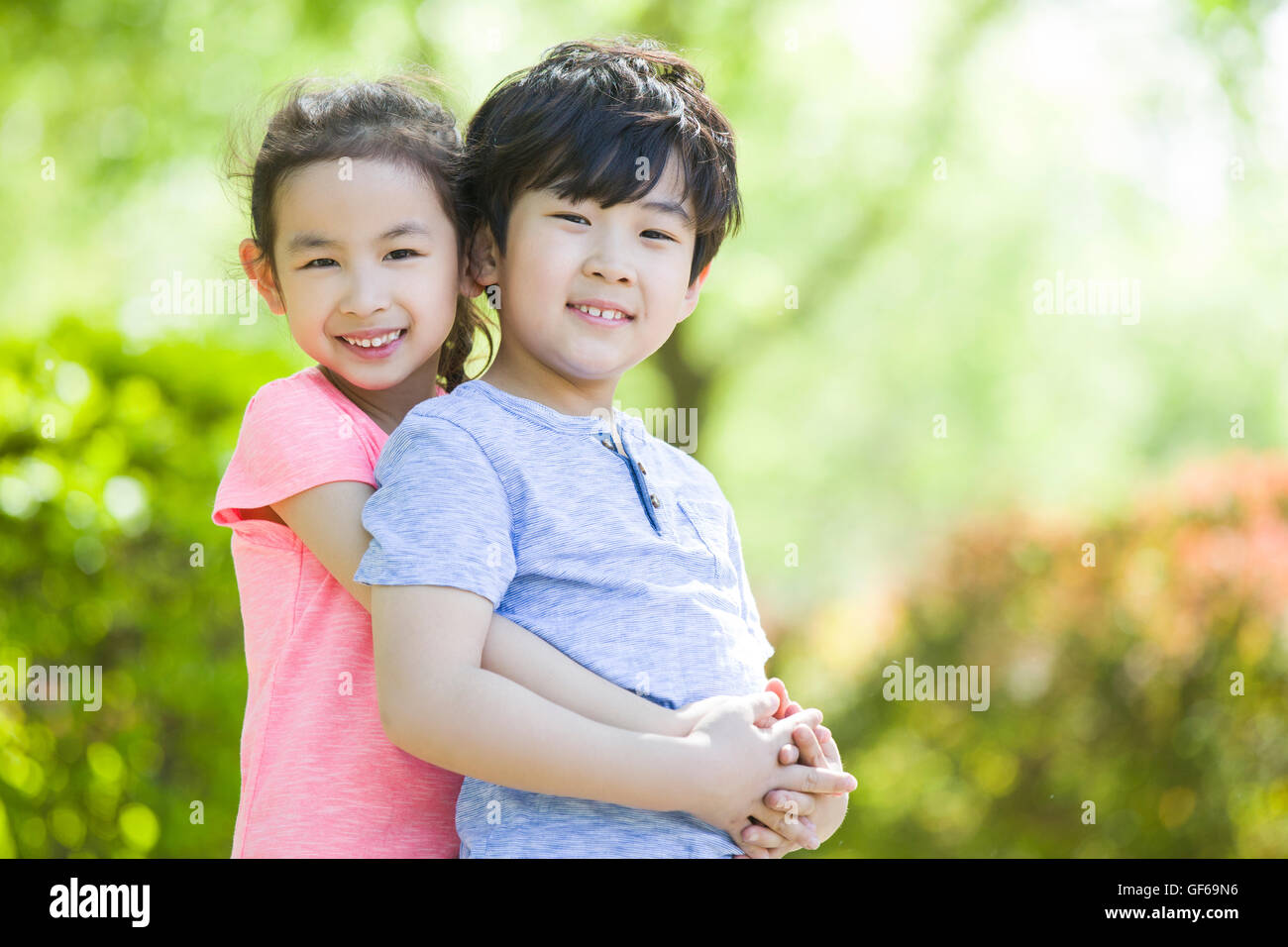 Portrait of happy Chinese children in woods Stock Photo - Alamy