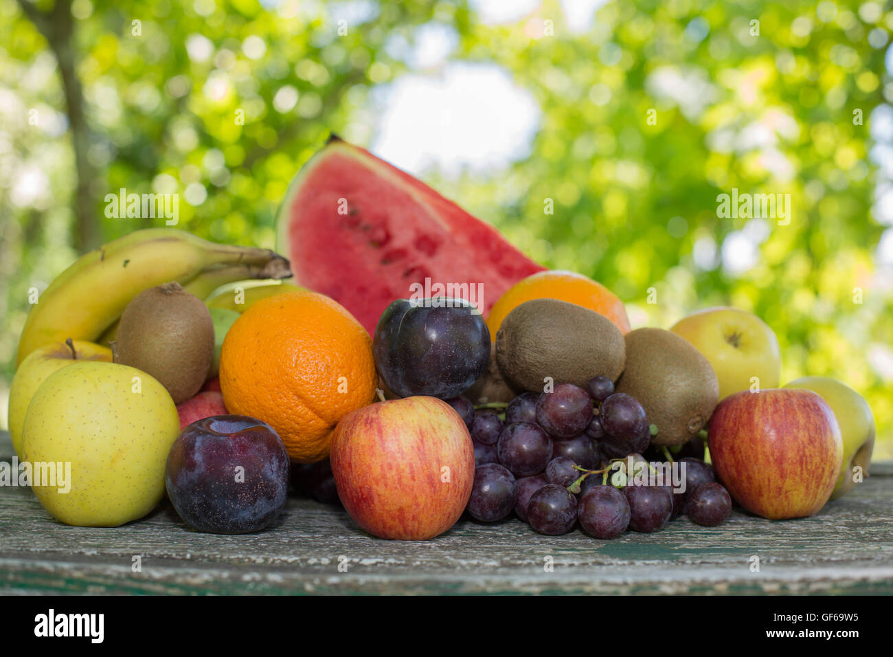 fruits in wooden table, outdoor Stock Photo - Alamy