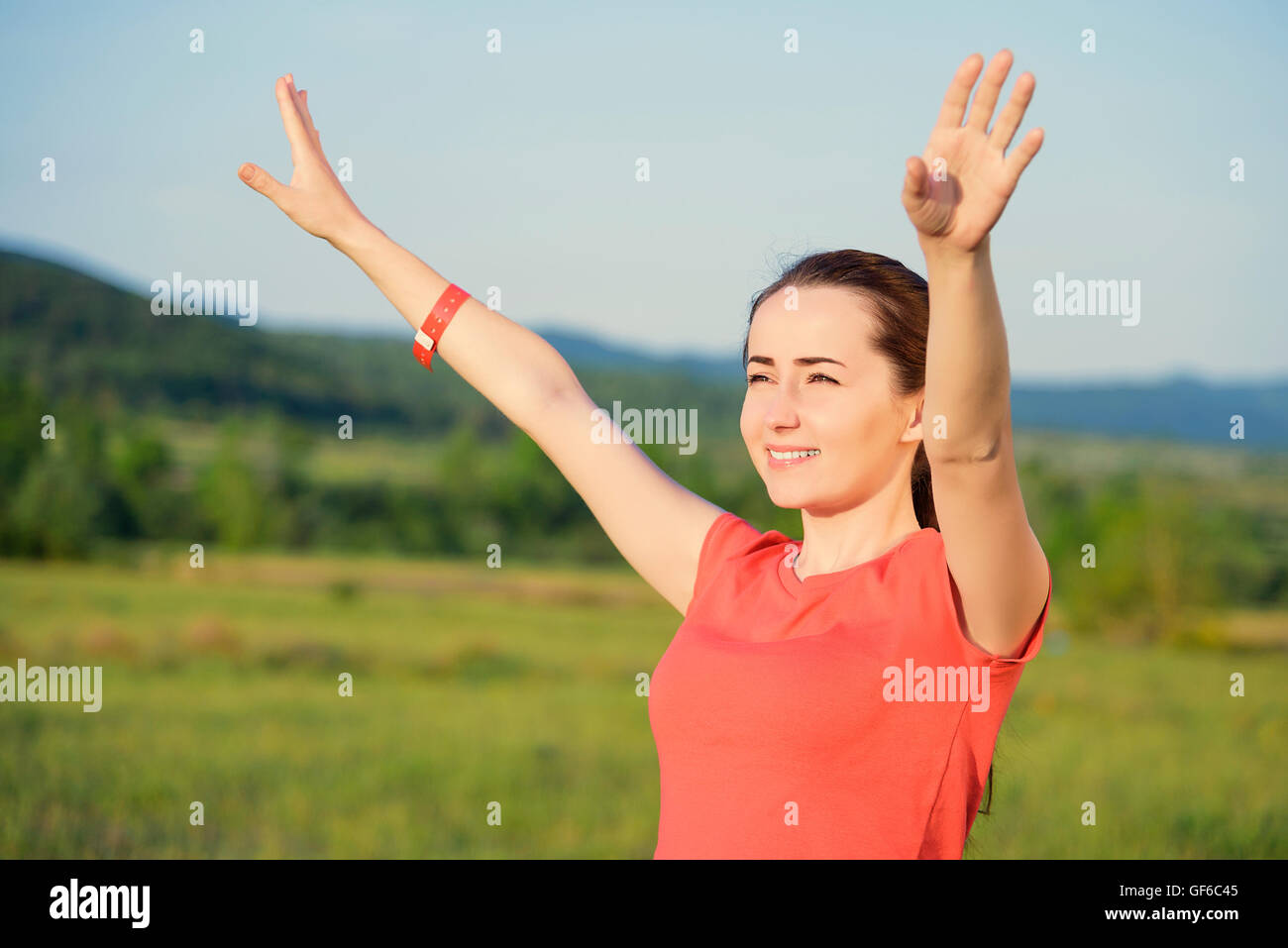 Girl raised her hands up hi-res stock photography and images - Alamy