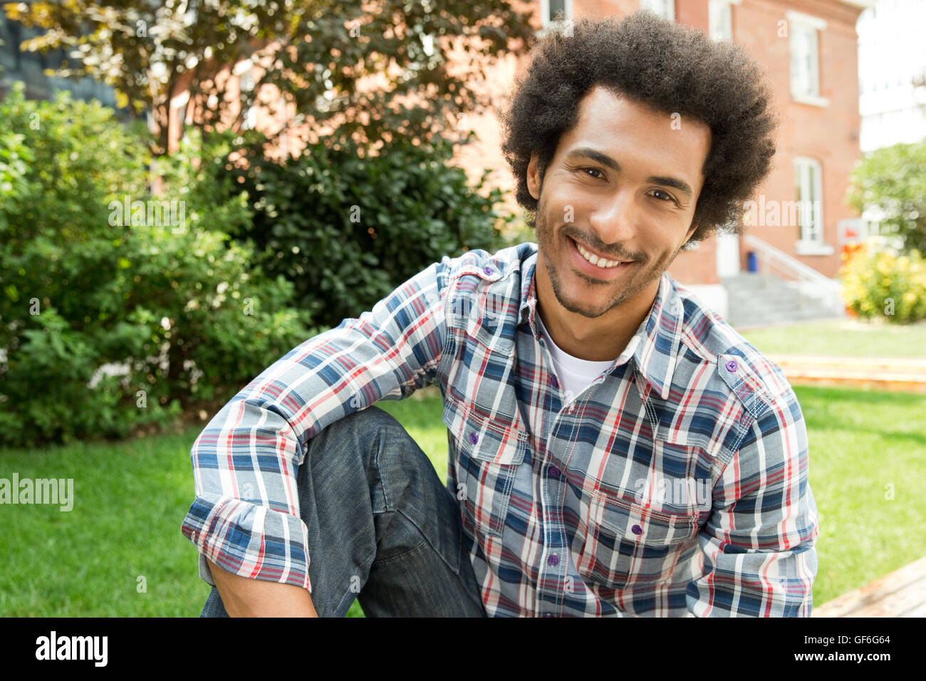 Portrait of young man at college campus Stock Photo - Alamy