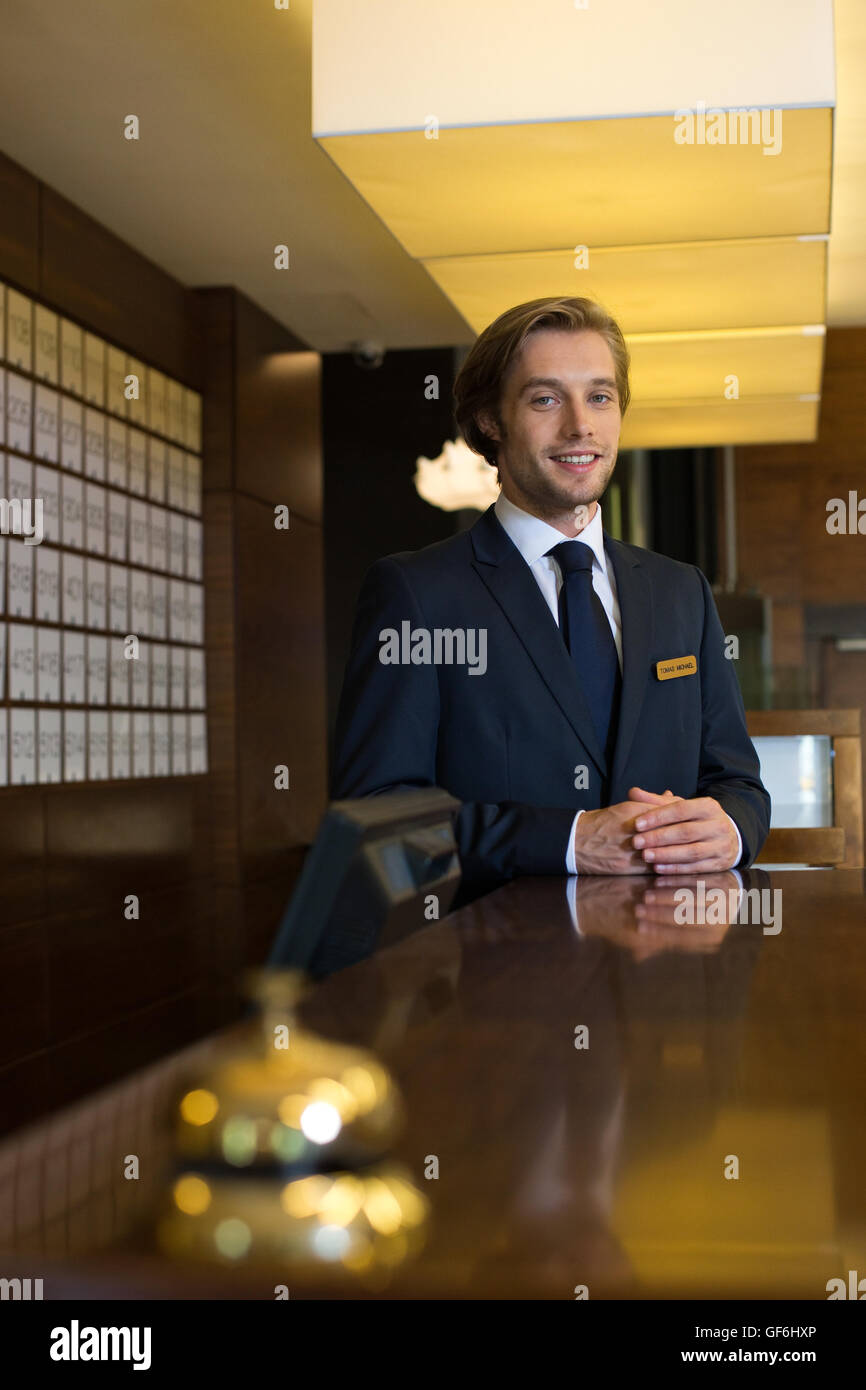 Portrait of receptionist standing in hotel Stock Photo - Alamy