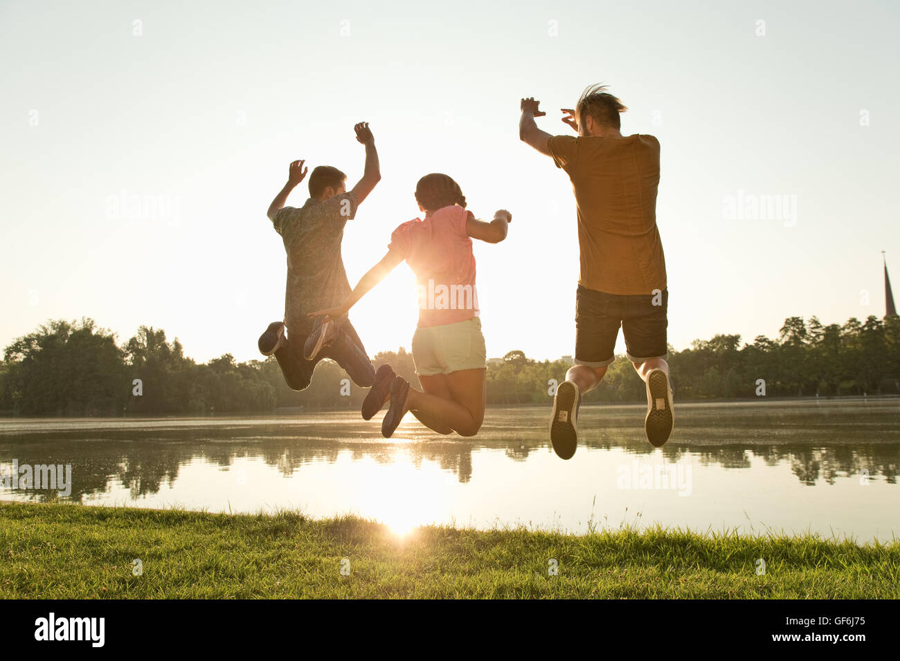 Jumping happy woman cell phone hi-res stock photography and images - Alamy