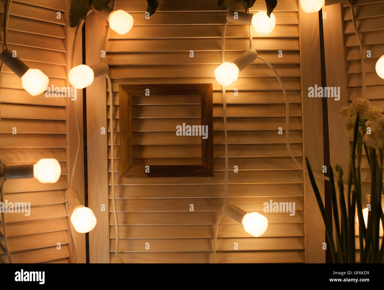 decorative bulbs and frame for photo in a wooden interior Stock Photo ...