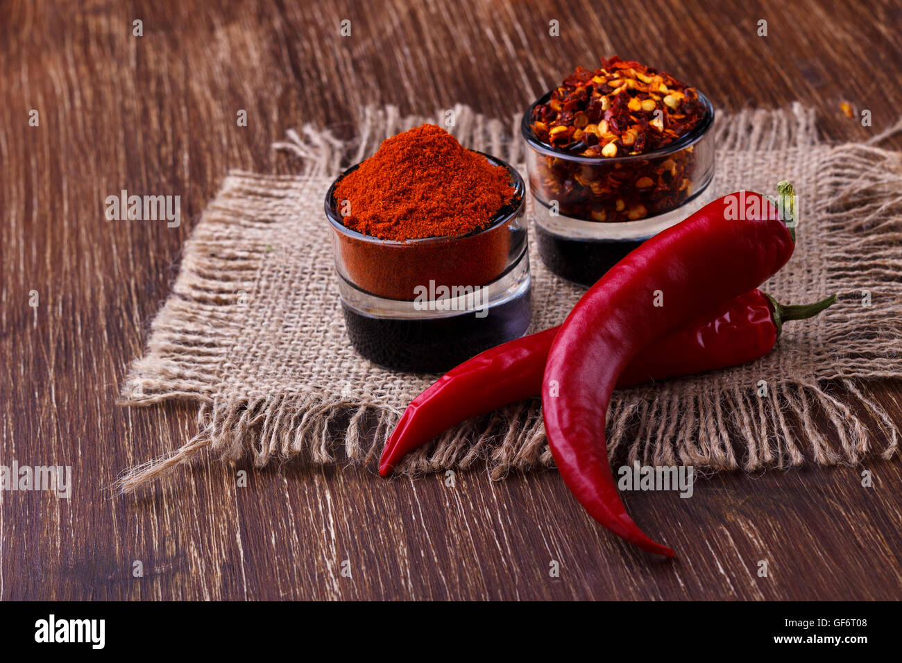 Chili peppers on rustic background, fresh , seeds and powder Stock ...