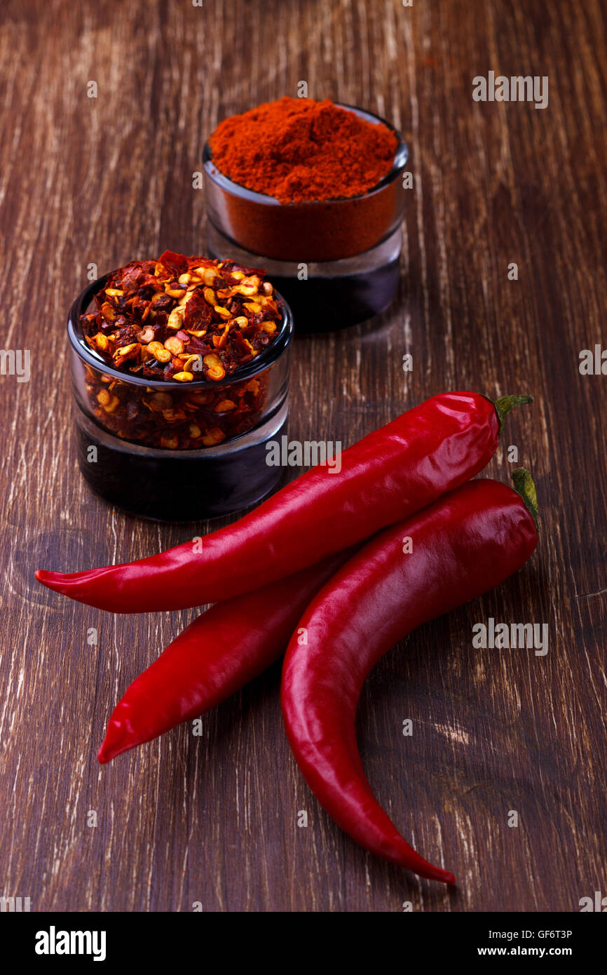 Chili peppers on rustic background, fresh , seeds and powder Stock ...
