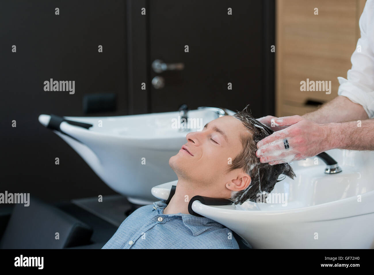 Man having hair washed in hi-res stock photography and images - Alamy