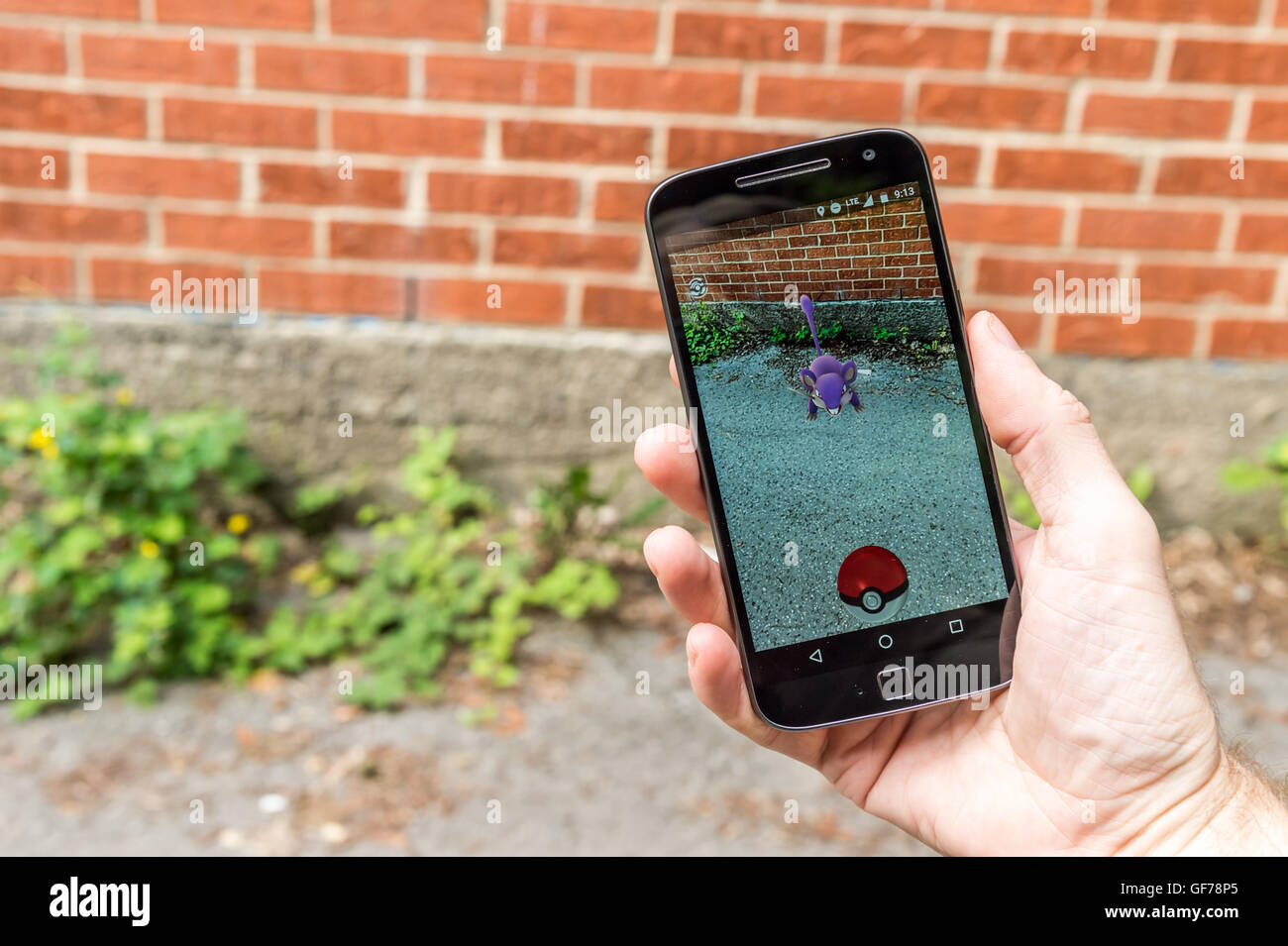 Montreal, CA - July 28, 2016: Closeup of a man playing Pokemon Go on a ...