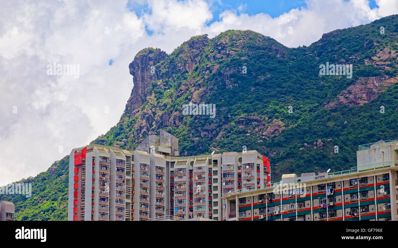 hong kong public estate with landmark lion rock at day Stock Photo - Alamy