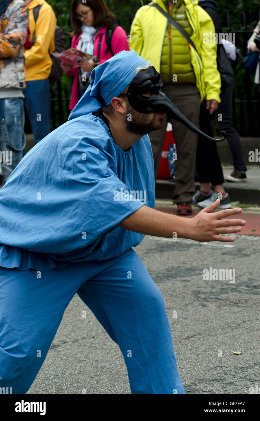 Male dancer with a long-nosed mask taking part in the Carnival Parade ...