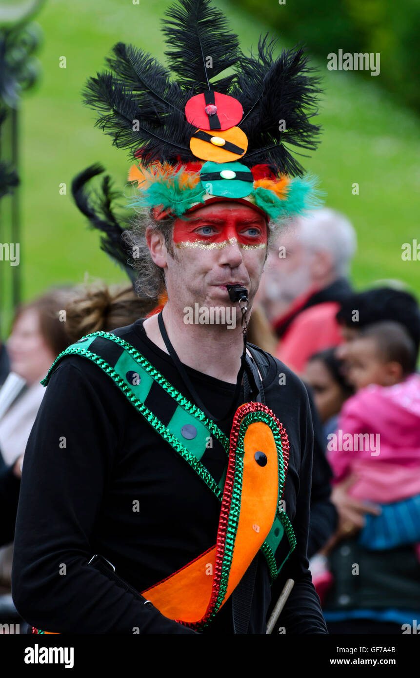 Male drum band leader in unusually decorated hat taking part in the ...