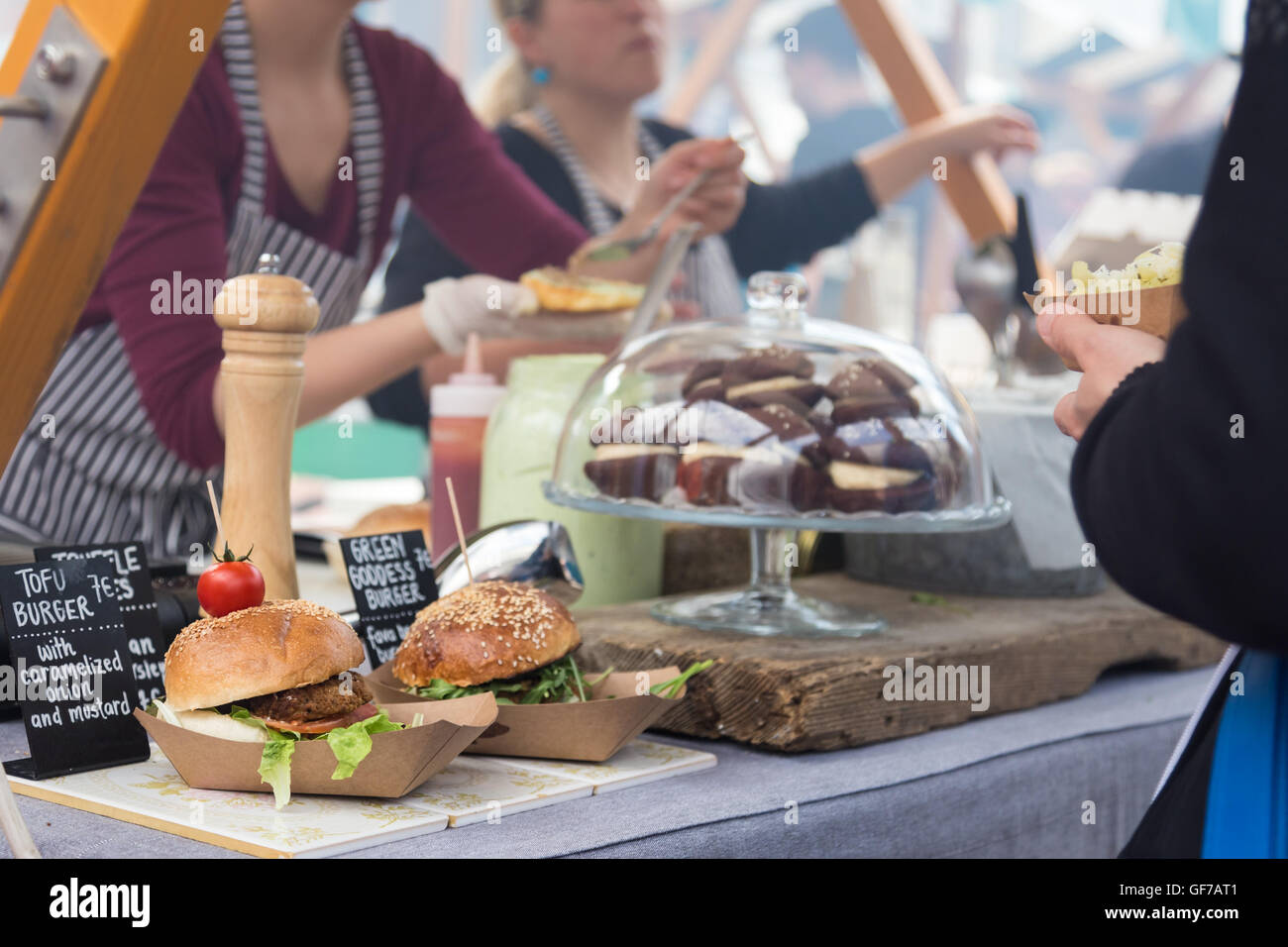 Vegetarian burgers being served on street food stall Stock Photo - Alamy