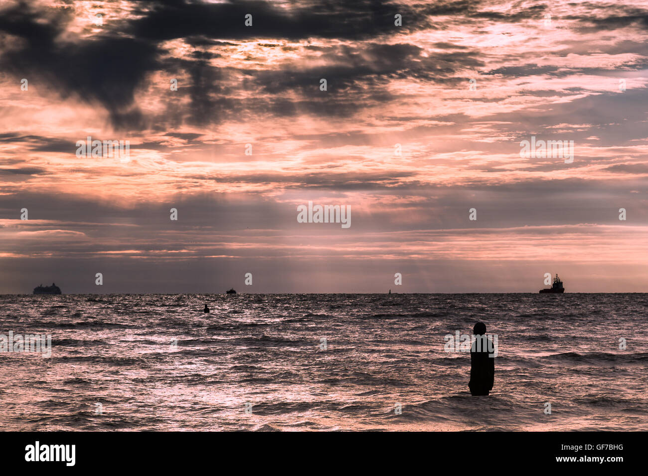 The sunlight glows on one of the dozens of Iron Men sculptures on the ...