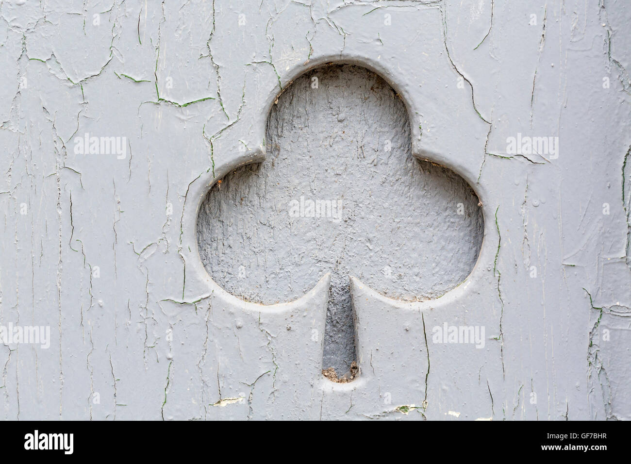 old grungy shamrock sign shaped in a wood wall Stock Photo - Alamy