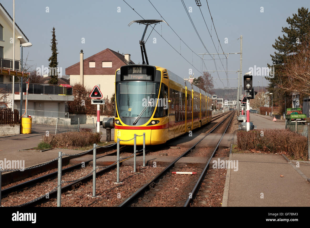 A tram in Therwil travelling from Basel city to Ettingen, Switzerland ...