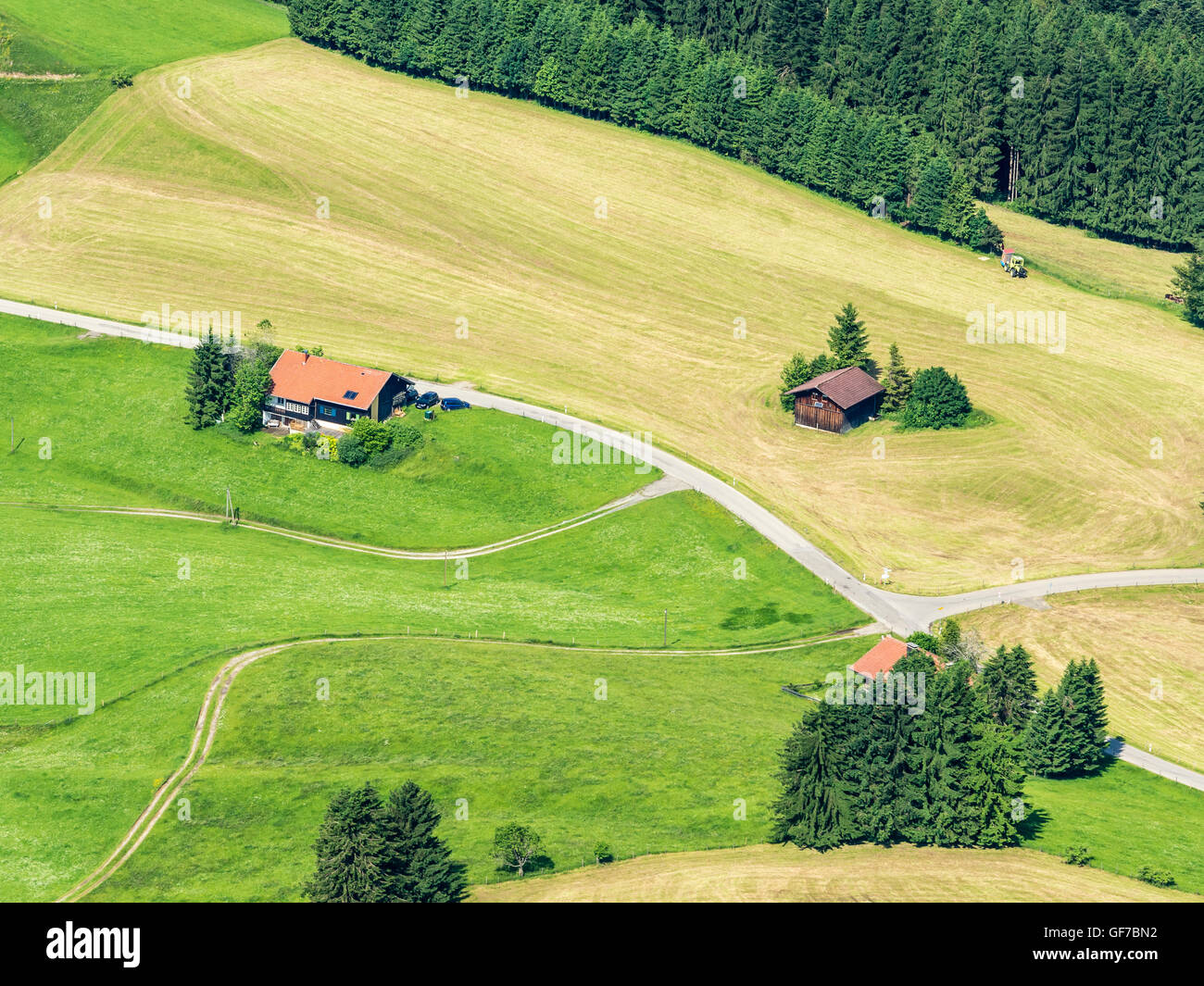 Traditional farm house, small farm road, aerial view, slope of bavarian ...