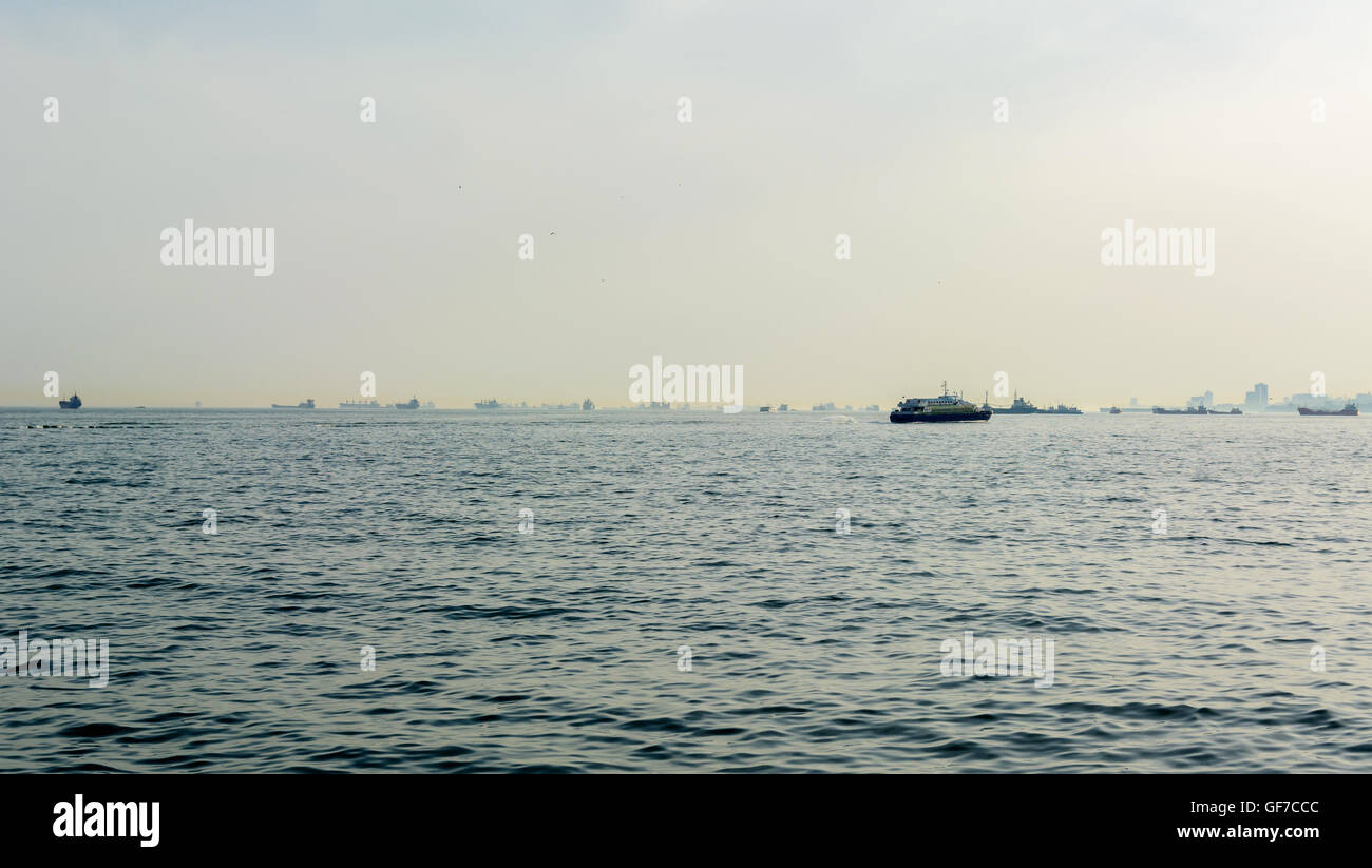 accumulation of cargo ships in the sea on the horizon during a queue ...