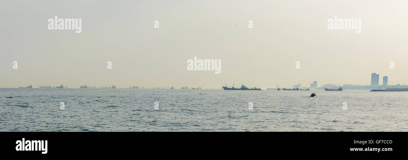 accumulation of cargo ships in the sea on the horizon during a queue ...