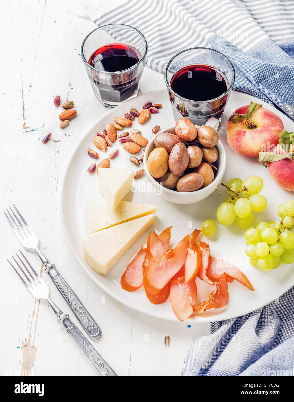 Wine snack set. Cheese, chicken carpaccio, mediterranean olives, fruits ...