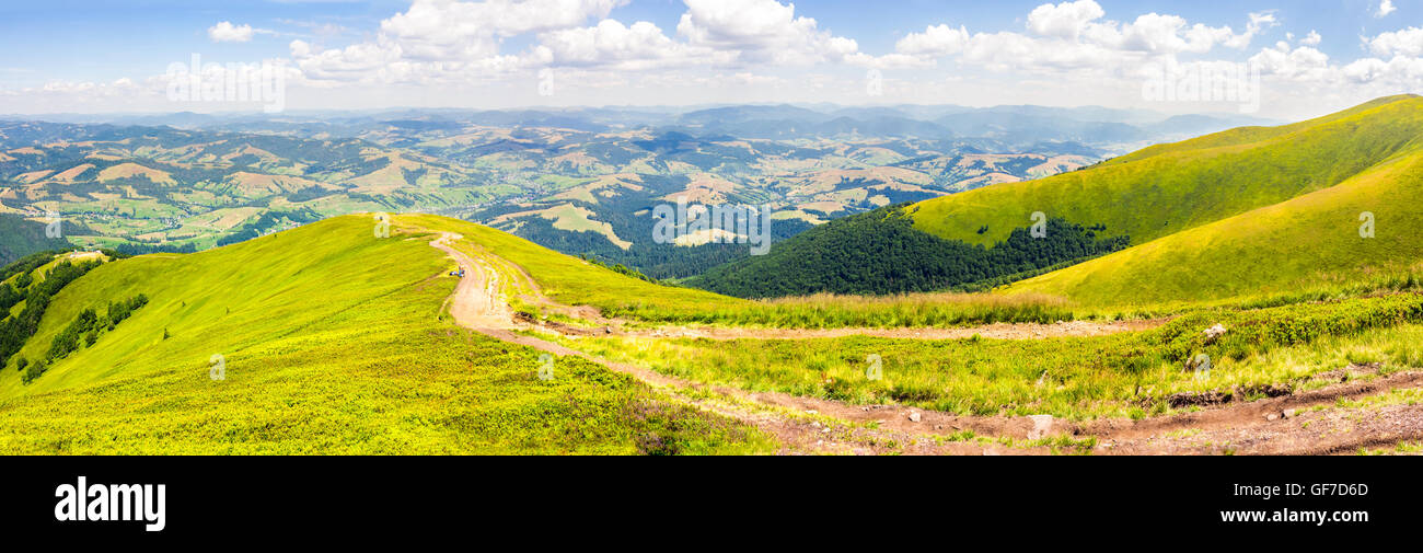 panoramic mountain landscape. curve path through the meadow on hillside ...